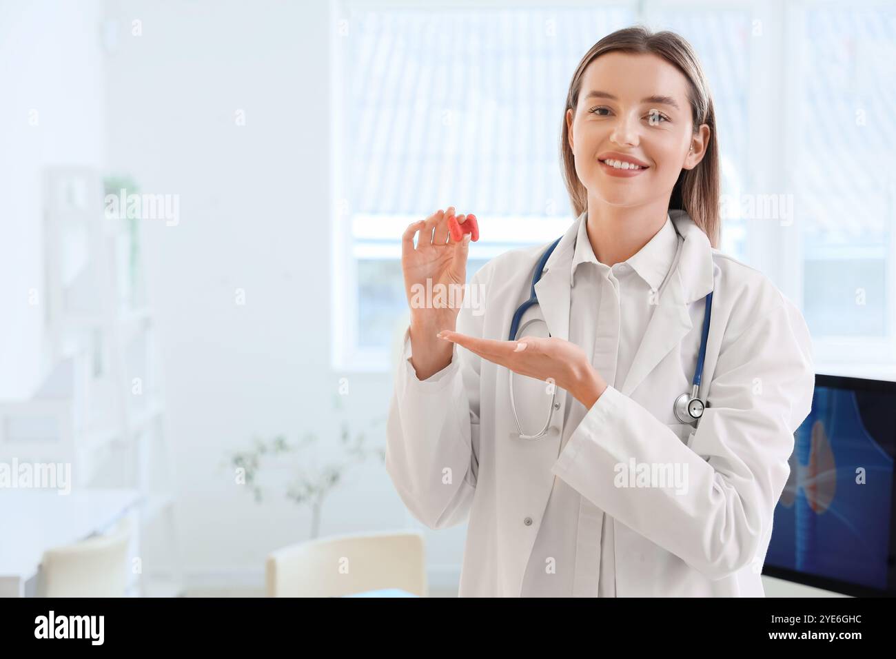 Female endocrinologist with thyroid gland model in clinic Stock Photo ...