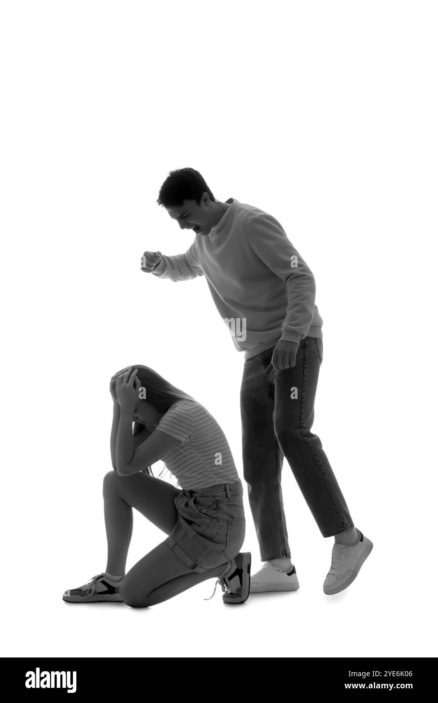 Silhouette of angry man beating his wife on white background. Domestic ...