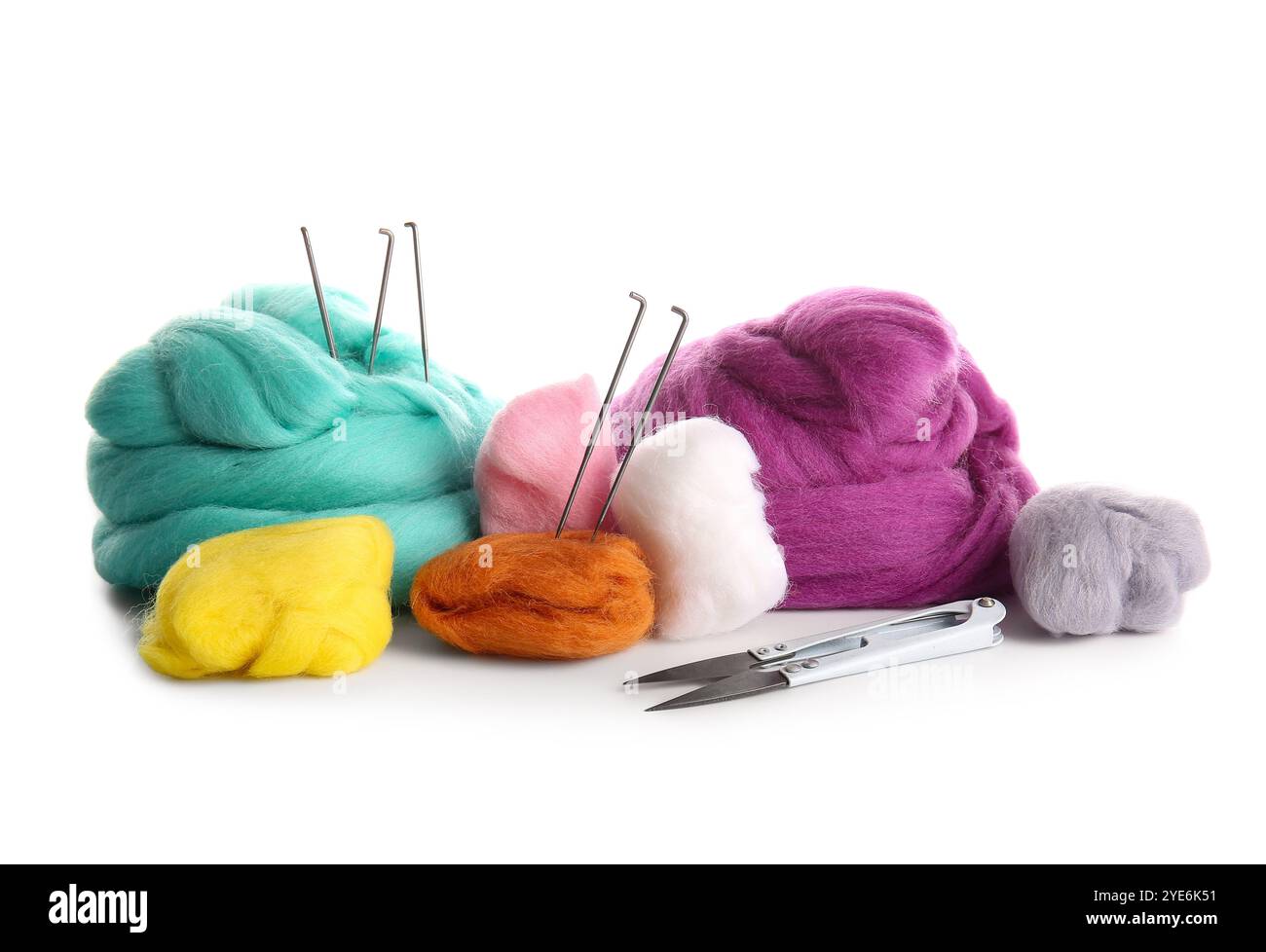 Set of colorful wool for felting with needles and thread cutter on ...