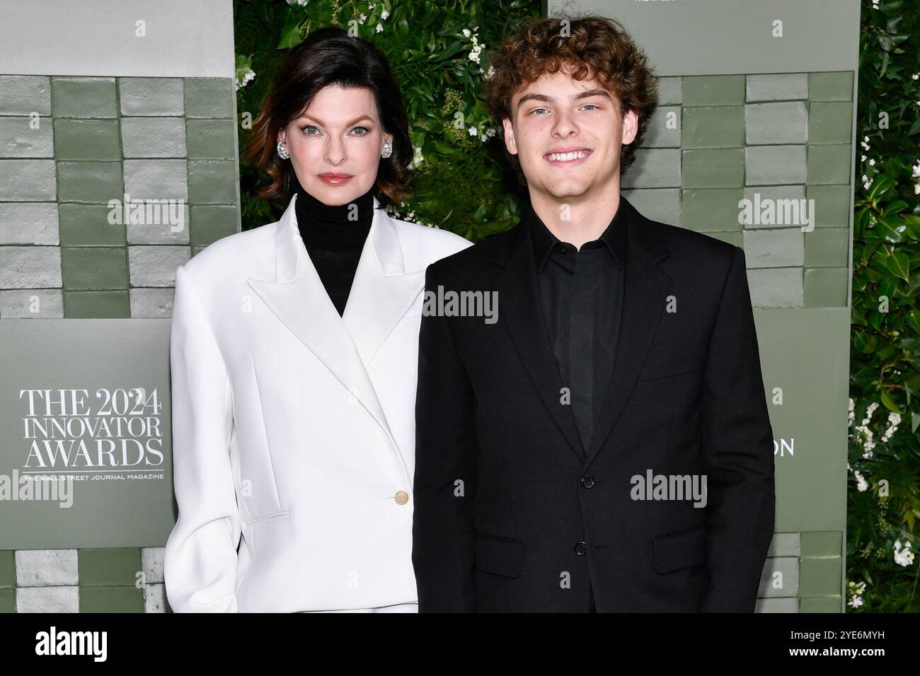 Linda Evangelista, left, and Augustin James Evangelista attend the WSJ ...