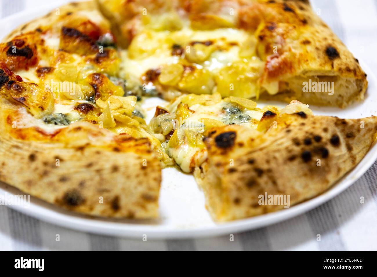 Traditional rustic pizza made with four cheeses, garlic and oil and ...