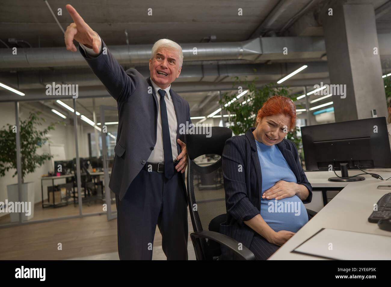 Boss fires pregnant subordinate woman from work Stock Photo - Alamy