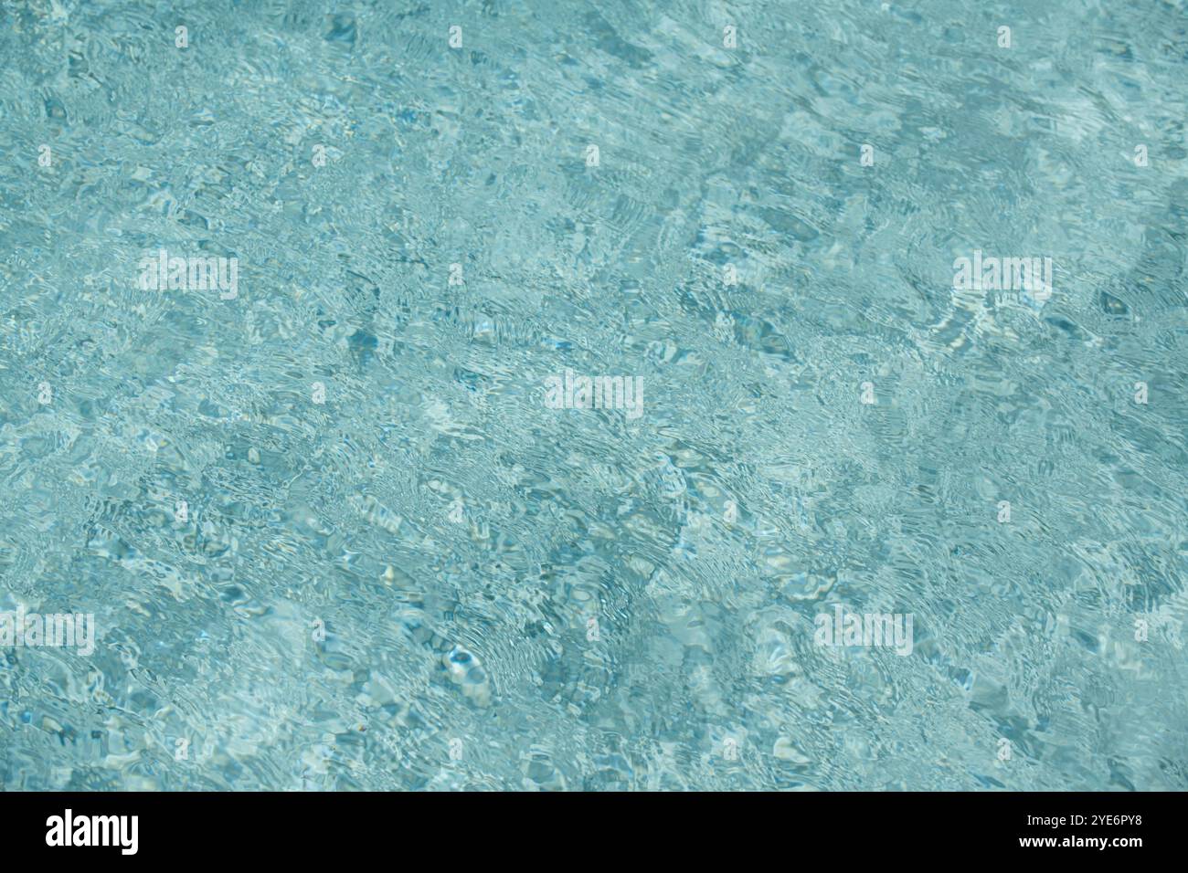 Ripple Water in swimming pool with sun reflection. Wavy water ...