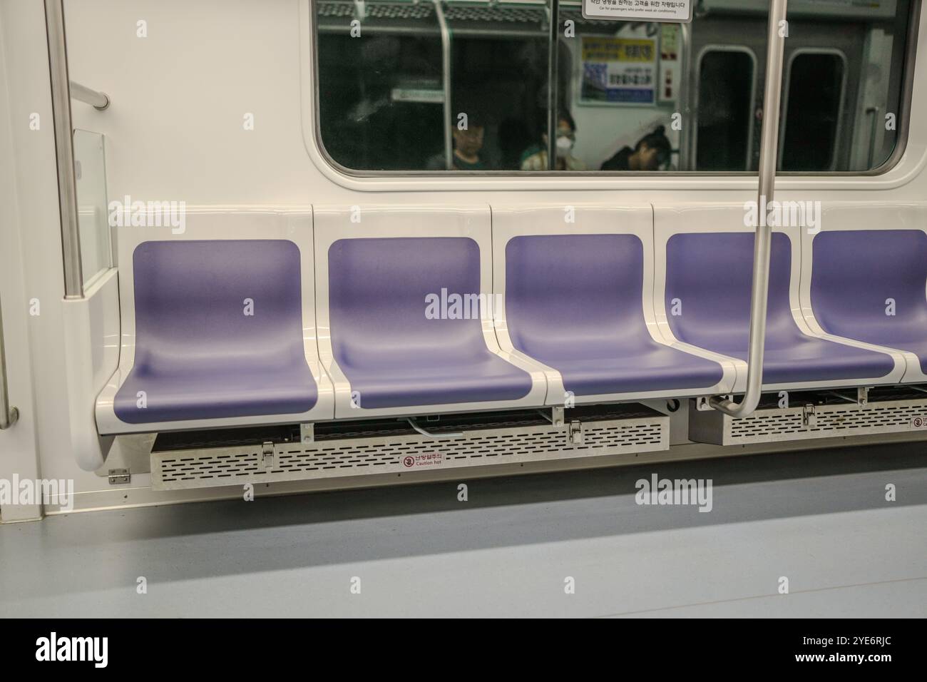 Train with a sign on the door that says "No Smoking". There are four ...