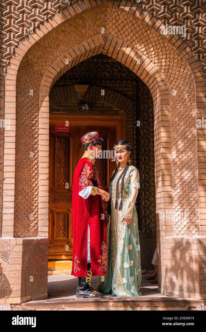 Kashgar, Xinjiang, China - JULY, 17, 2023: A couple wearing traditional ...