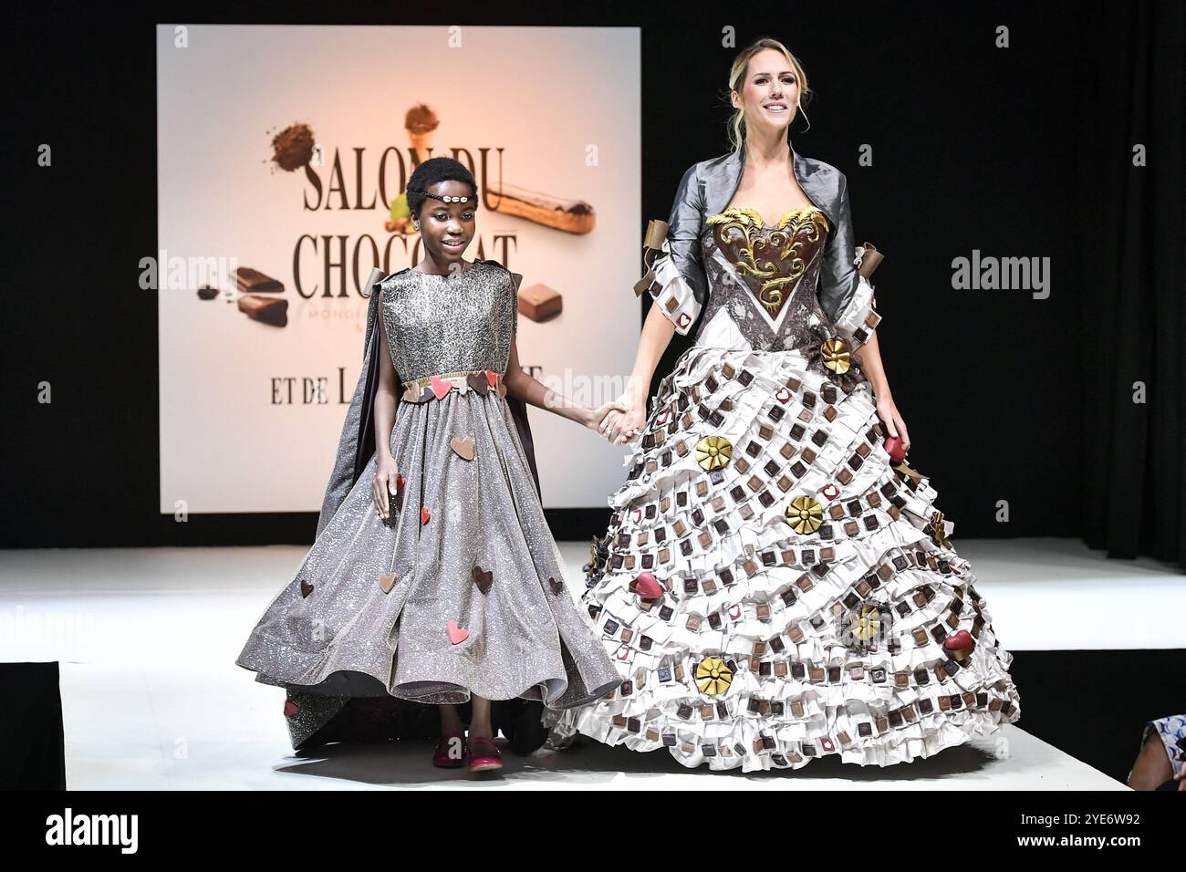 French journalist Sandy Heribert walks the runway with Little Princess ...