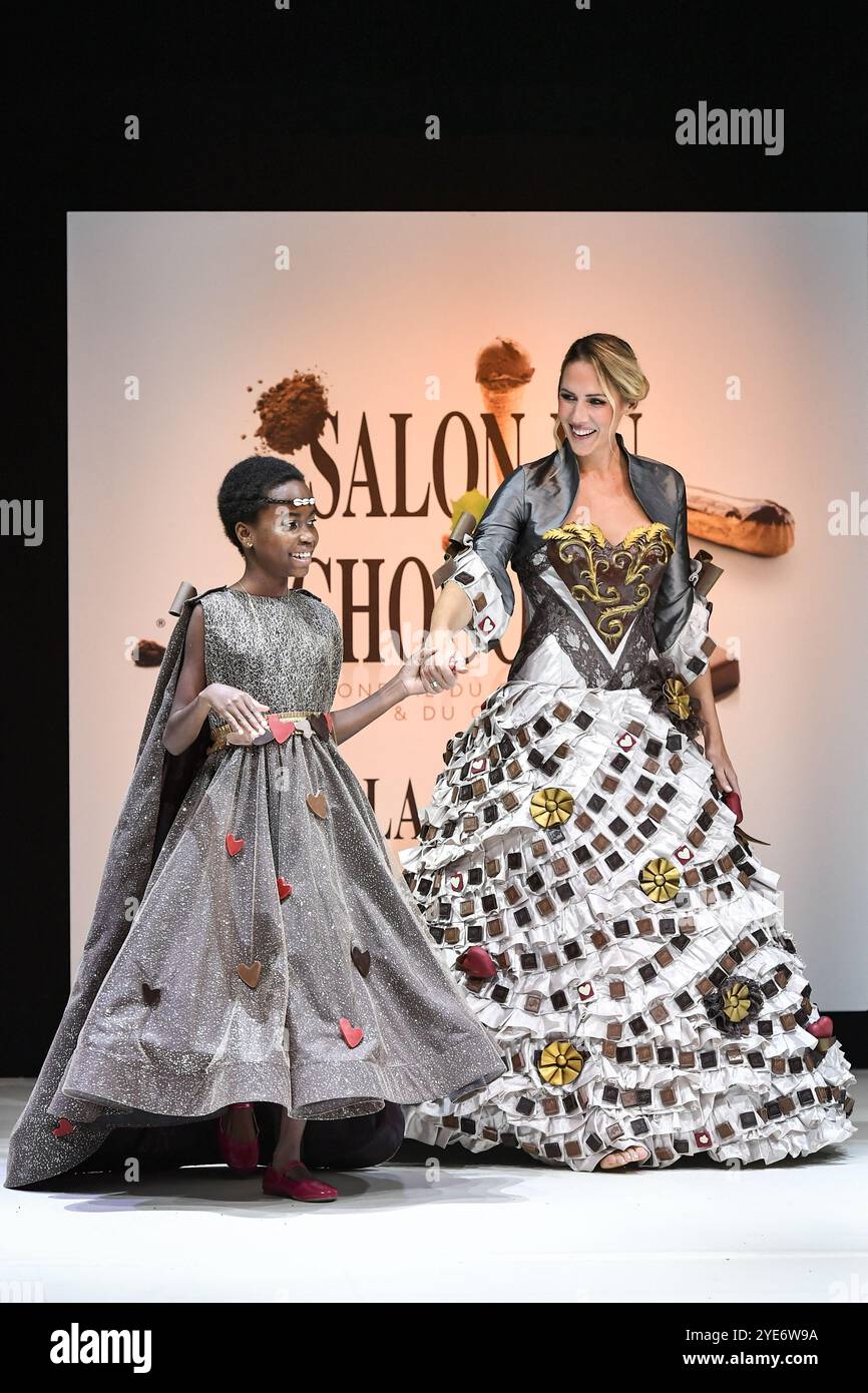 French journalist Sandy Heribert walks the runway with Little Princess ...