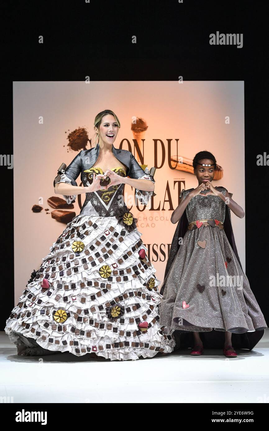 French journalist Sandy Heribert walks the runway with Little Princess ...