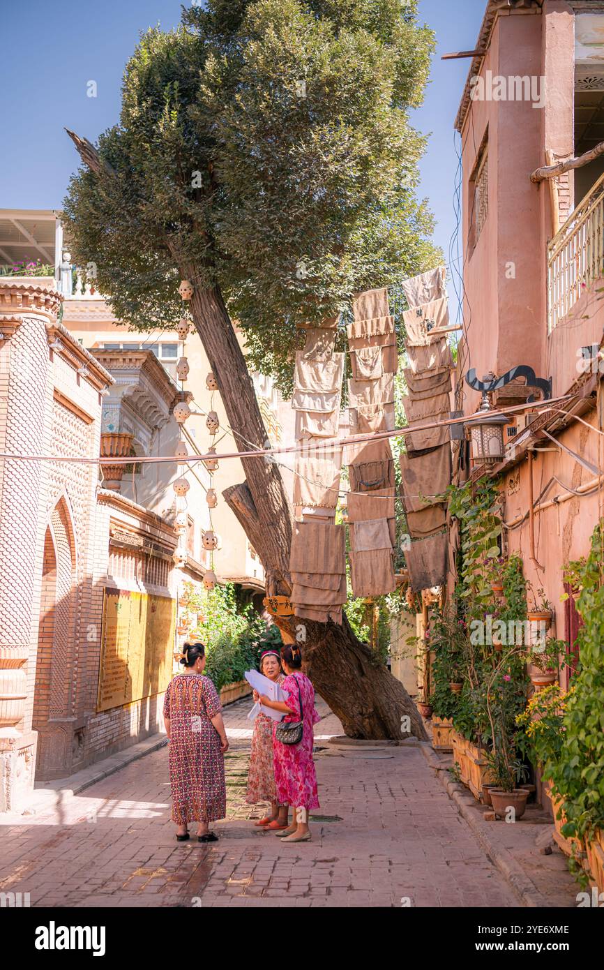 Kashgar, Xinjiang, China - JULY, 17, 2023: Uighur women walking along ...