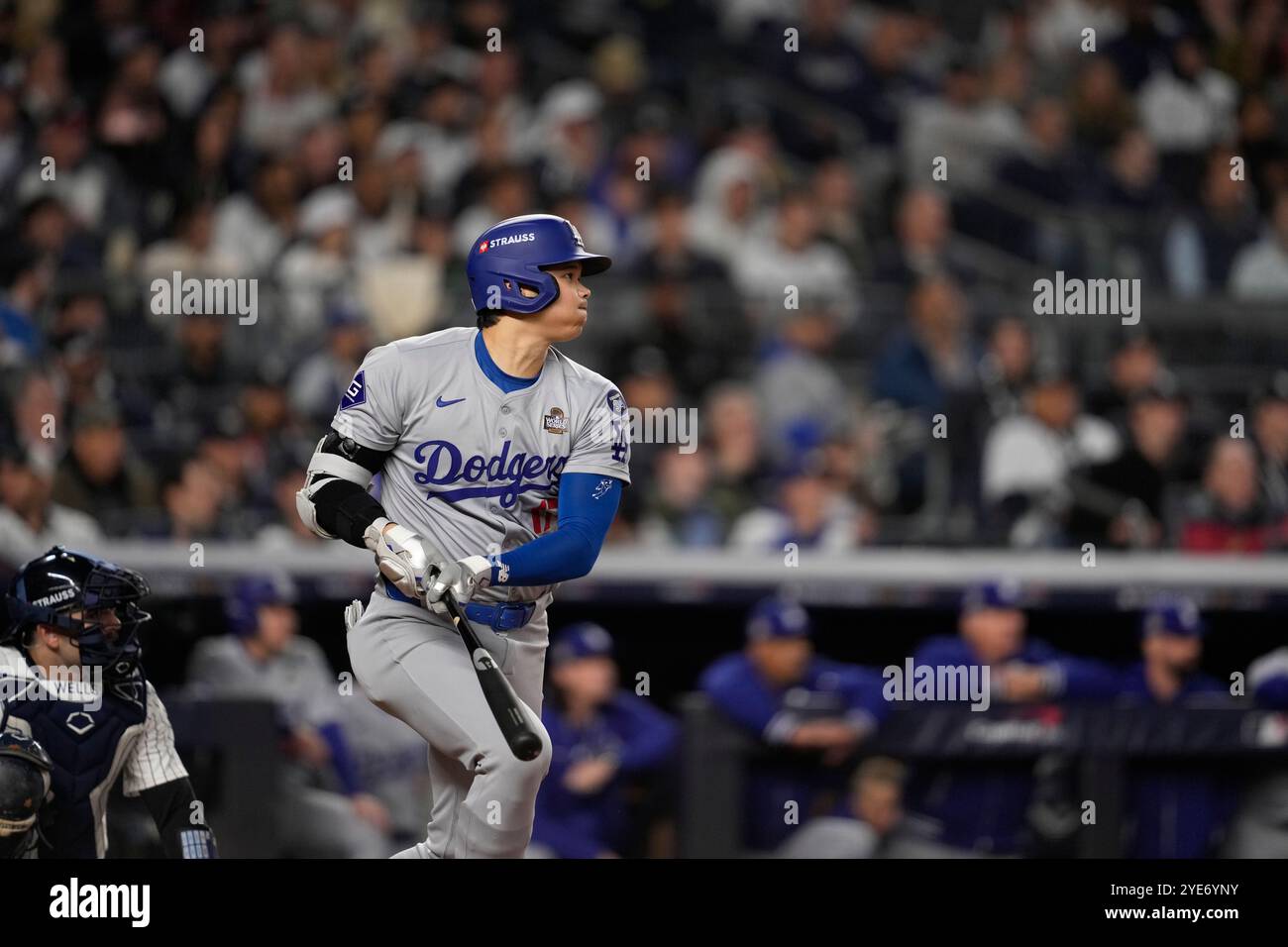 Los Angeles Dodgers' Shohei Ohtani watches his single against the New ...