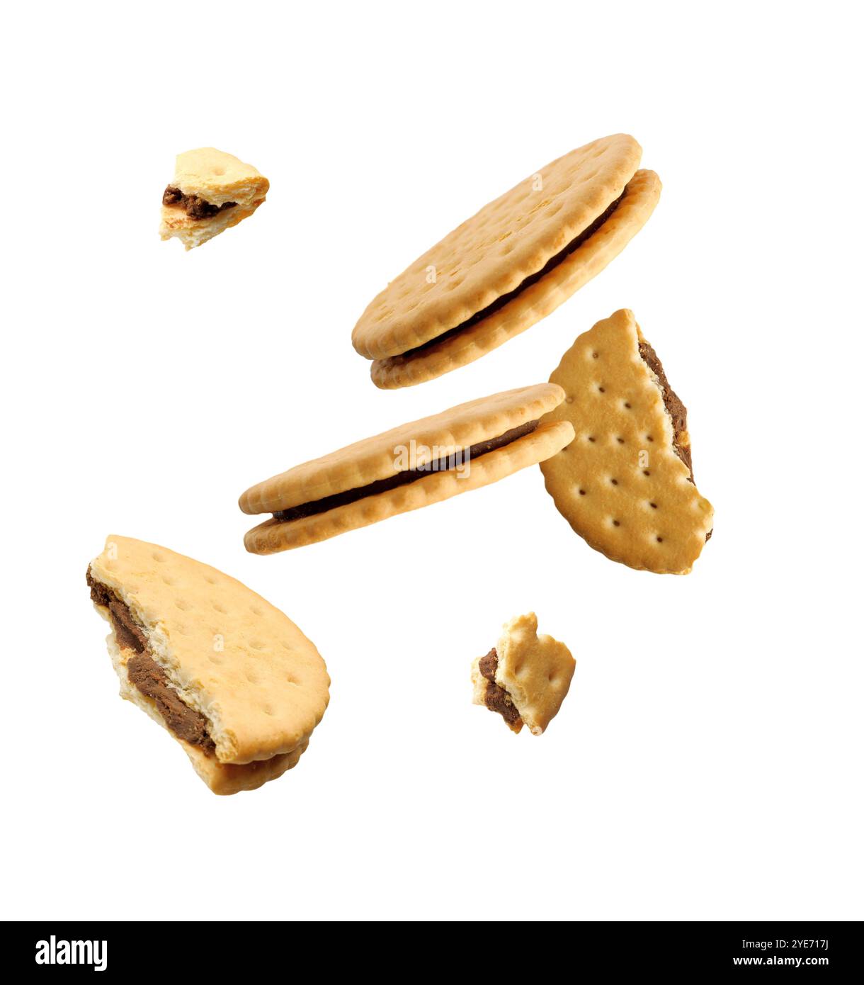 Tasty broken sandwich cookies in air on white background Stock Photo ...