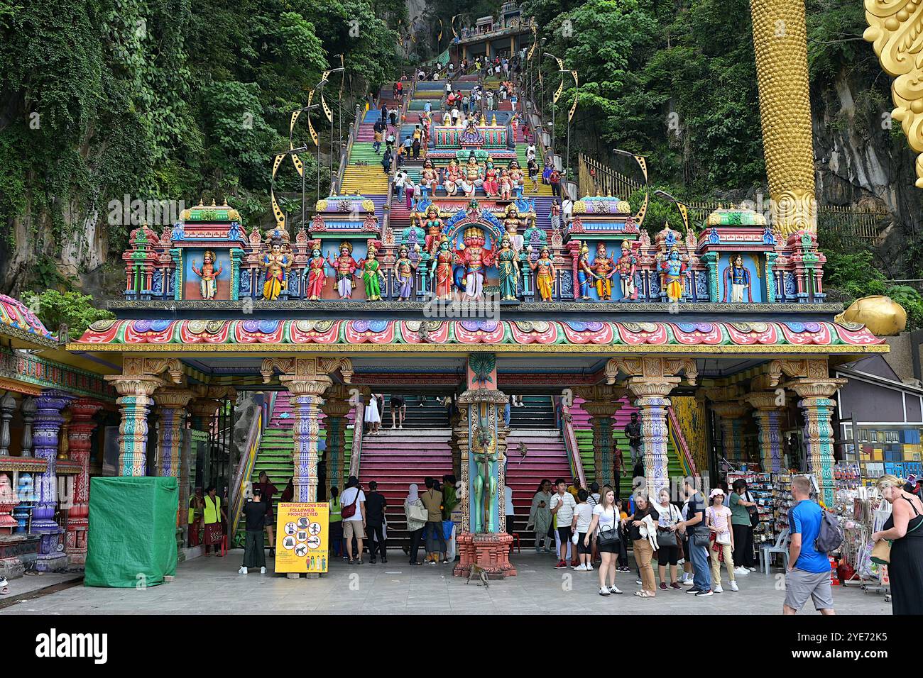 Steps leading up to Batu Caves with ornate gateway featuring six-headed ...