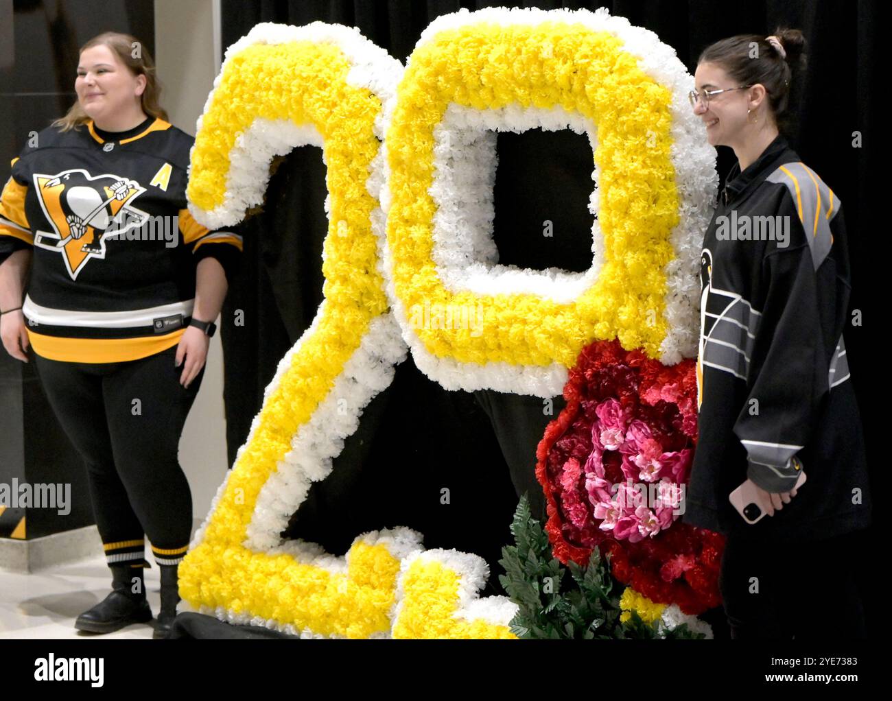 The Pittsburgh Penguins fans poses for a picture by the coral display ...