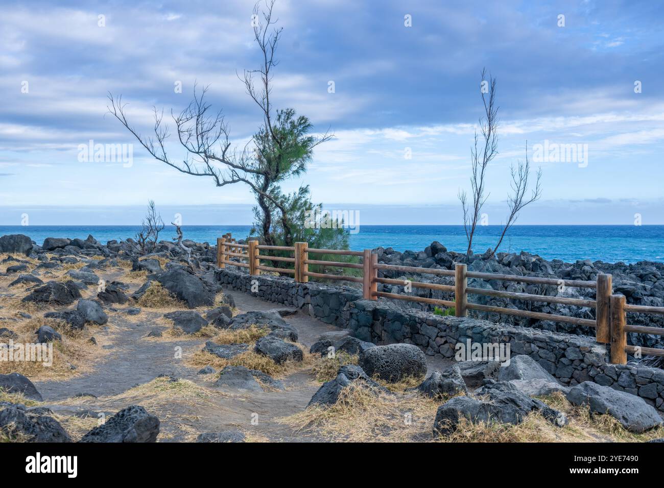A wooden fence lines a scenic coastal path at Cap Mechant, Reunion ...