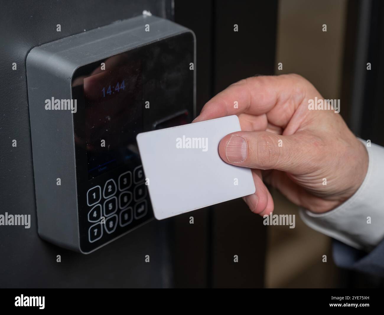 A man opens the door with a card. Modern electronic lock. Keyless Entry ...