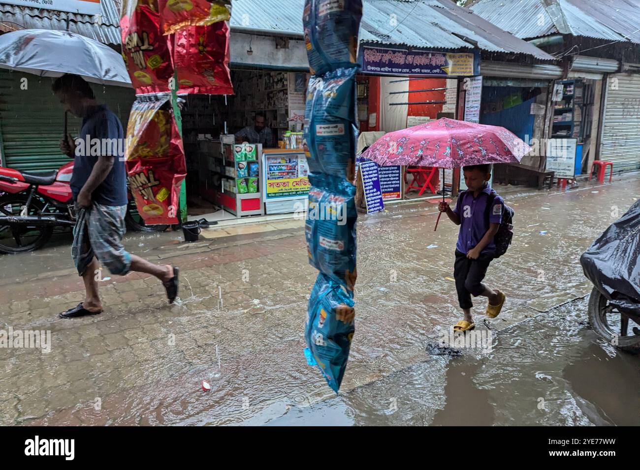 FENI, BANGLADESH - OCTOBER 6: Children back from school during heavy ...