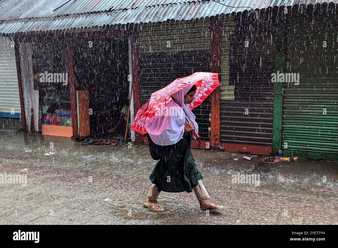 FENI, BANGLADESH - OCTOBER 6: Children back from school during heavy ...