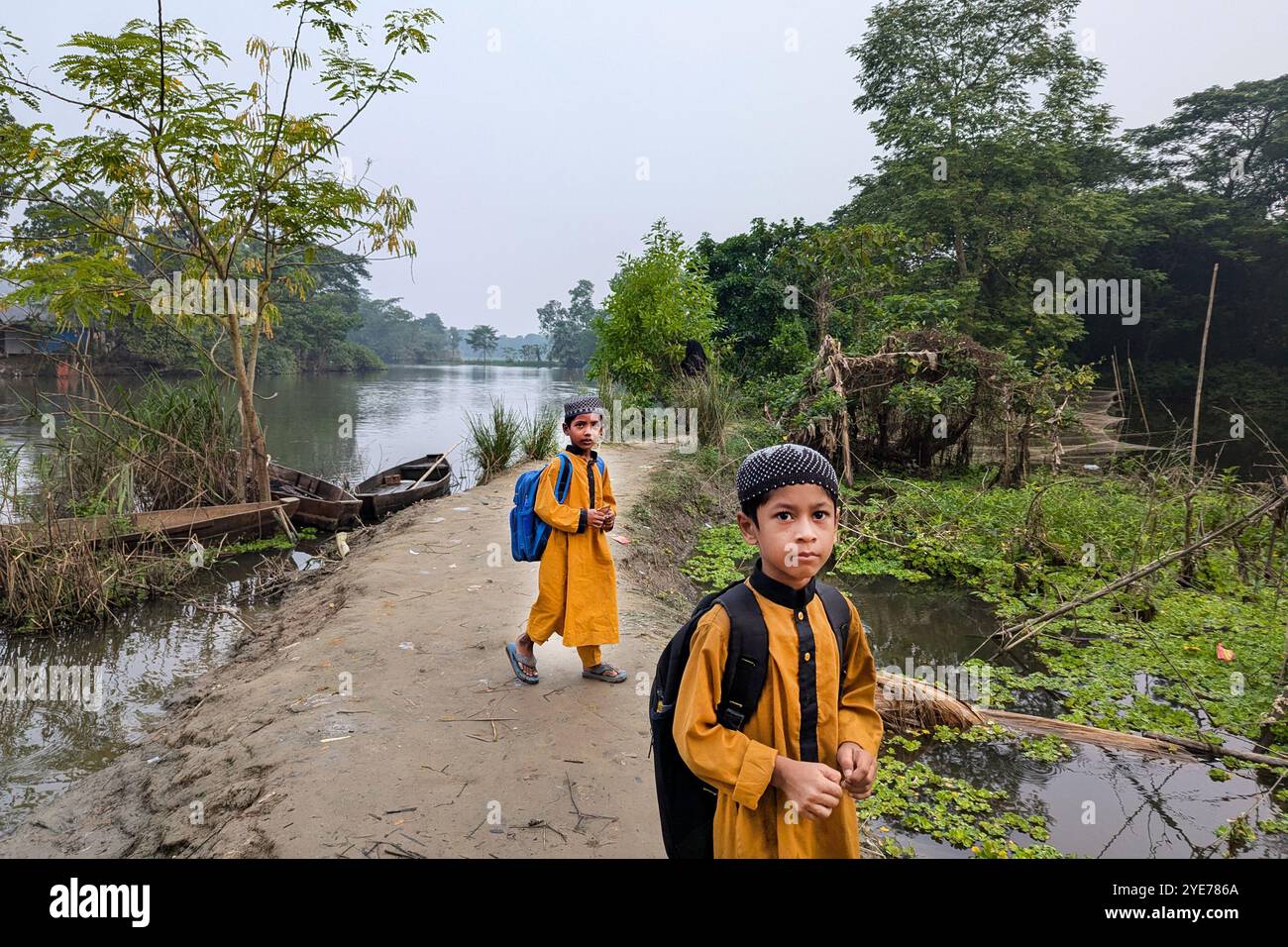 FENI, BANGLADESH - OCTOBER 16: Children going to school in the early ...