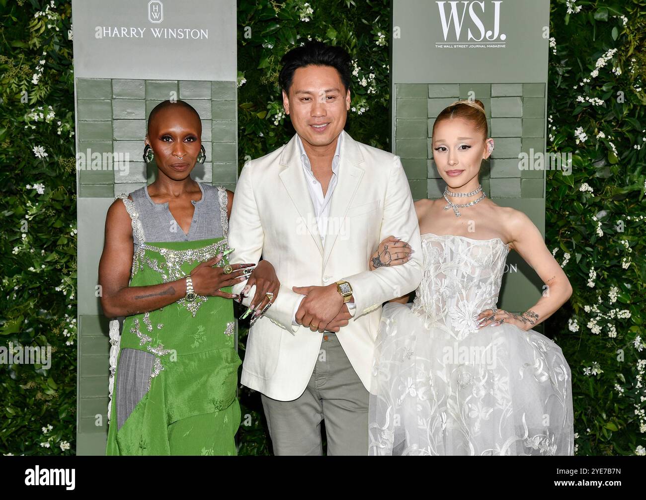 Cynthia Erivo, left, Jon M. Chu and Ariana Grande attend the WSJ ...