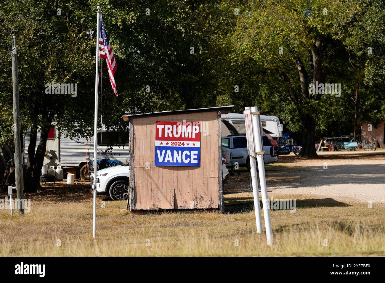 Residents display political signs and slogans as early voting is ...
