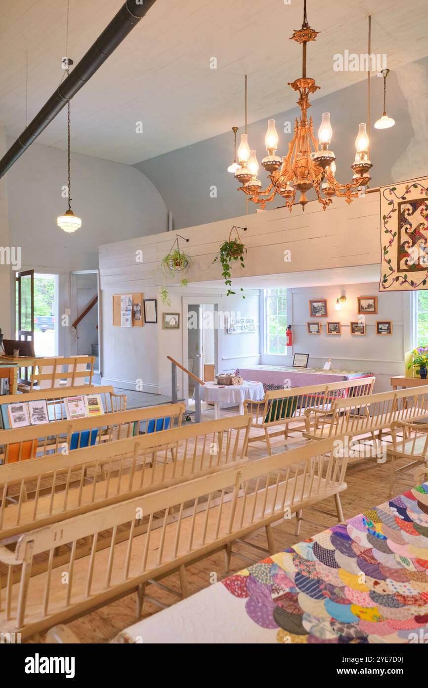 The simple, humble meeting room with wood benches. At the community ...