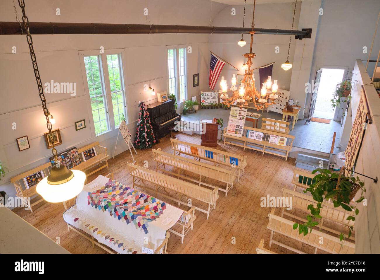 The simple, humble meeting room with wood benches. At the community ...