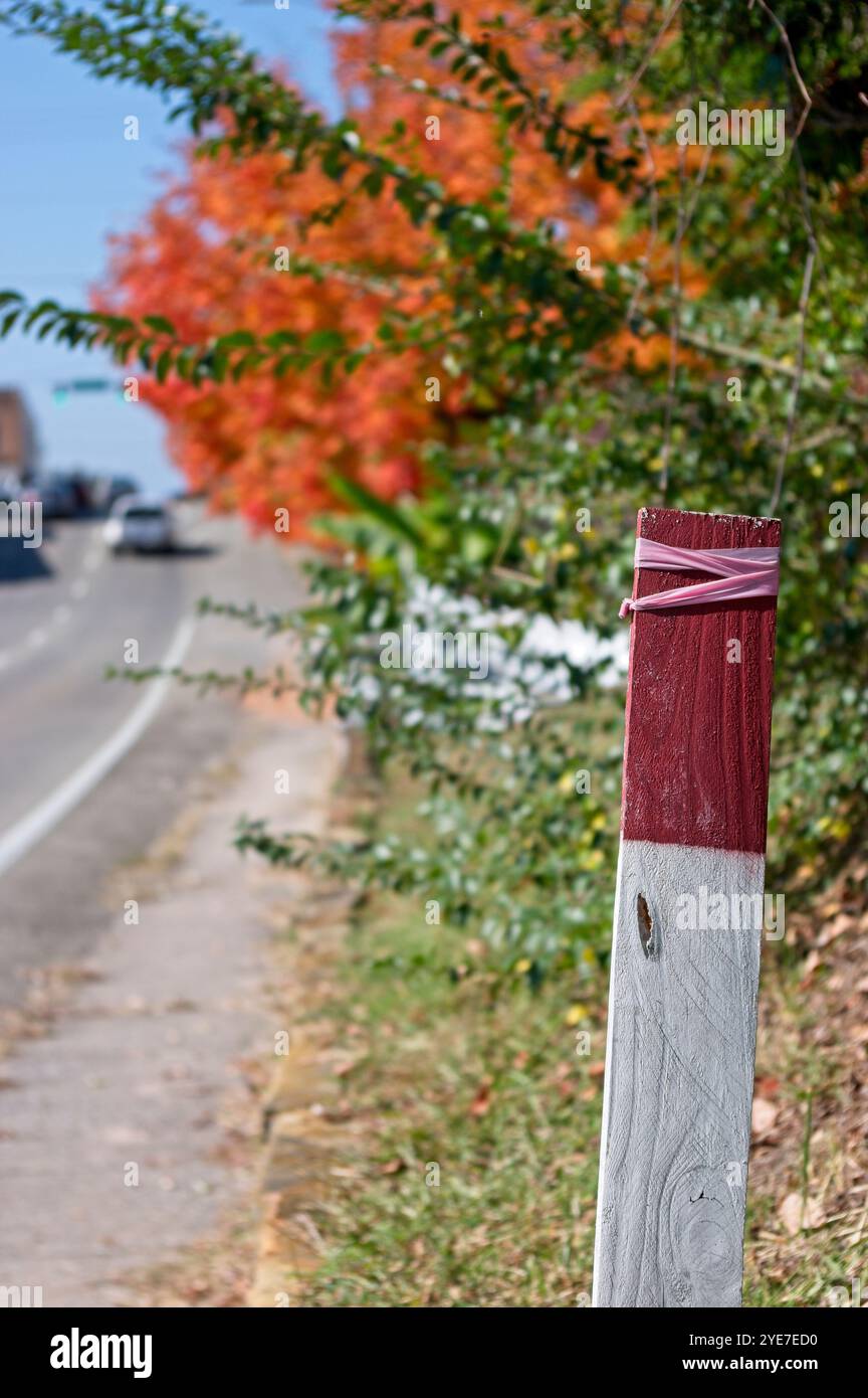 Boundary marker on the side of a road with copy space Stock Photo - Alamy
