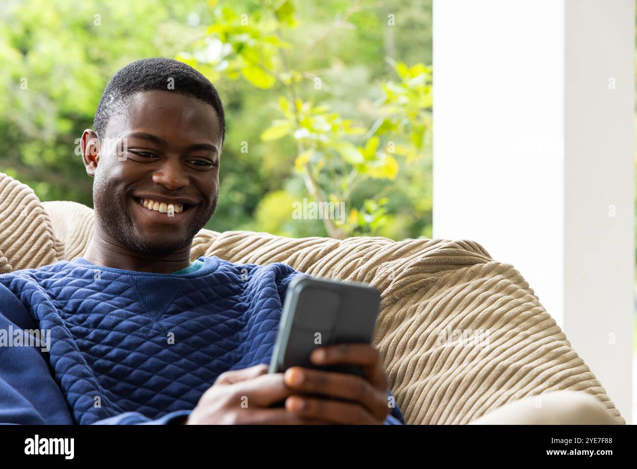 Positive man smiling using hi-res stock photography and images - Alamy