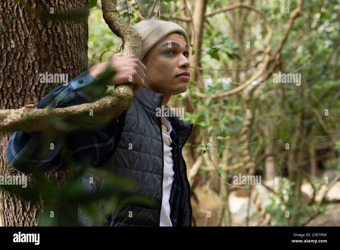 Young man wearing backpack holding hi-res stock photography and images ...
