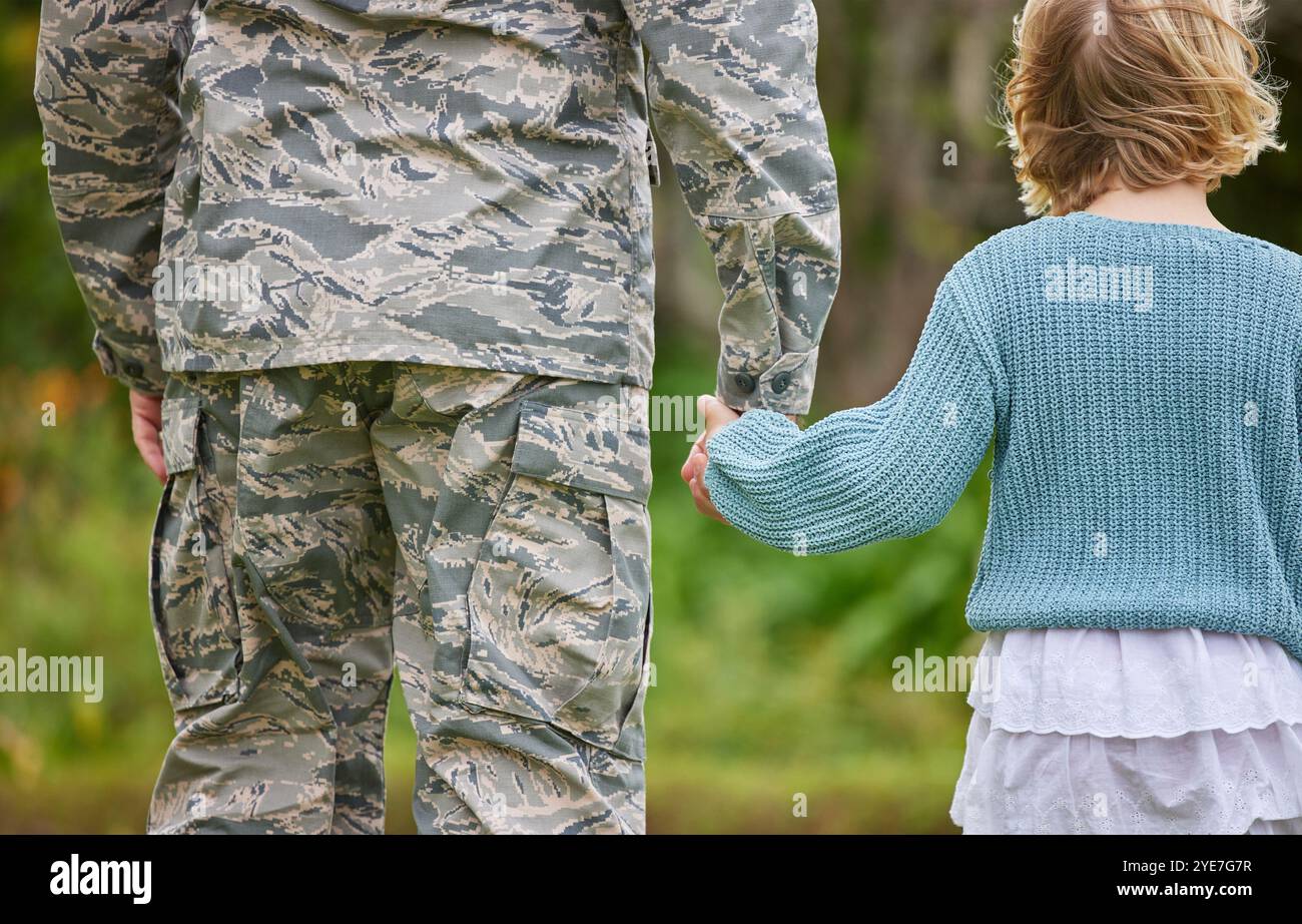 Back, family and child as soldier holding hands for return home ...
