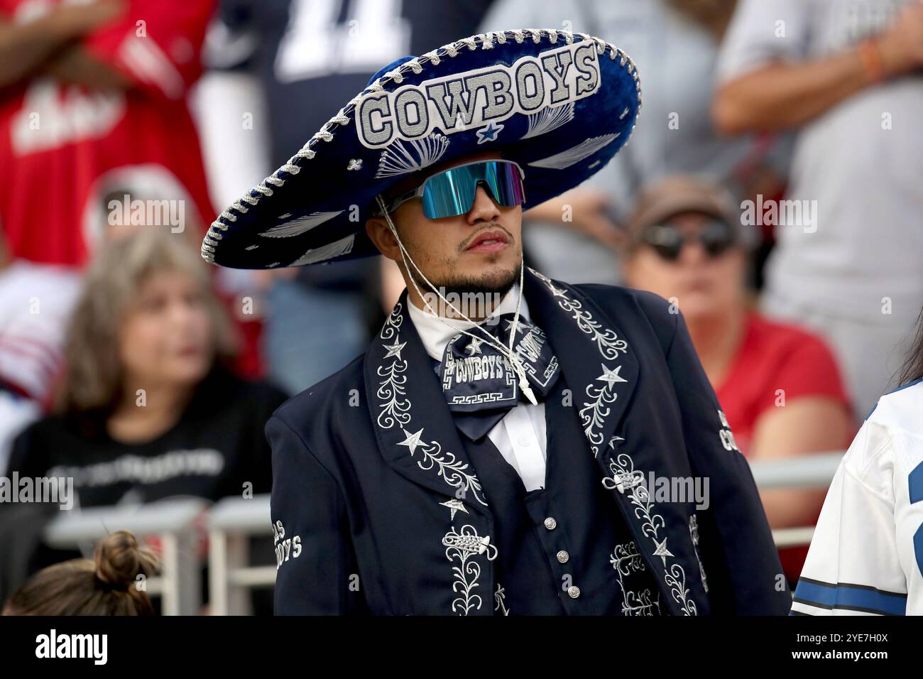 A Dallas Cowboys fan stands during an NFL football game between the San ...