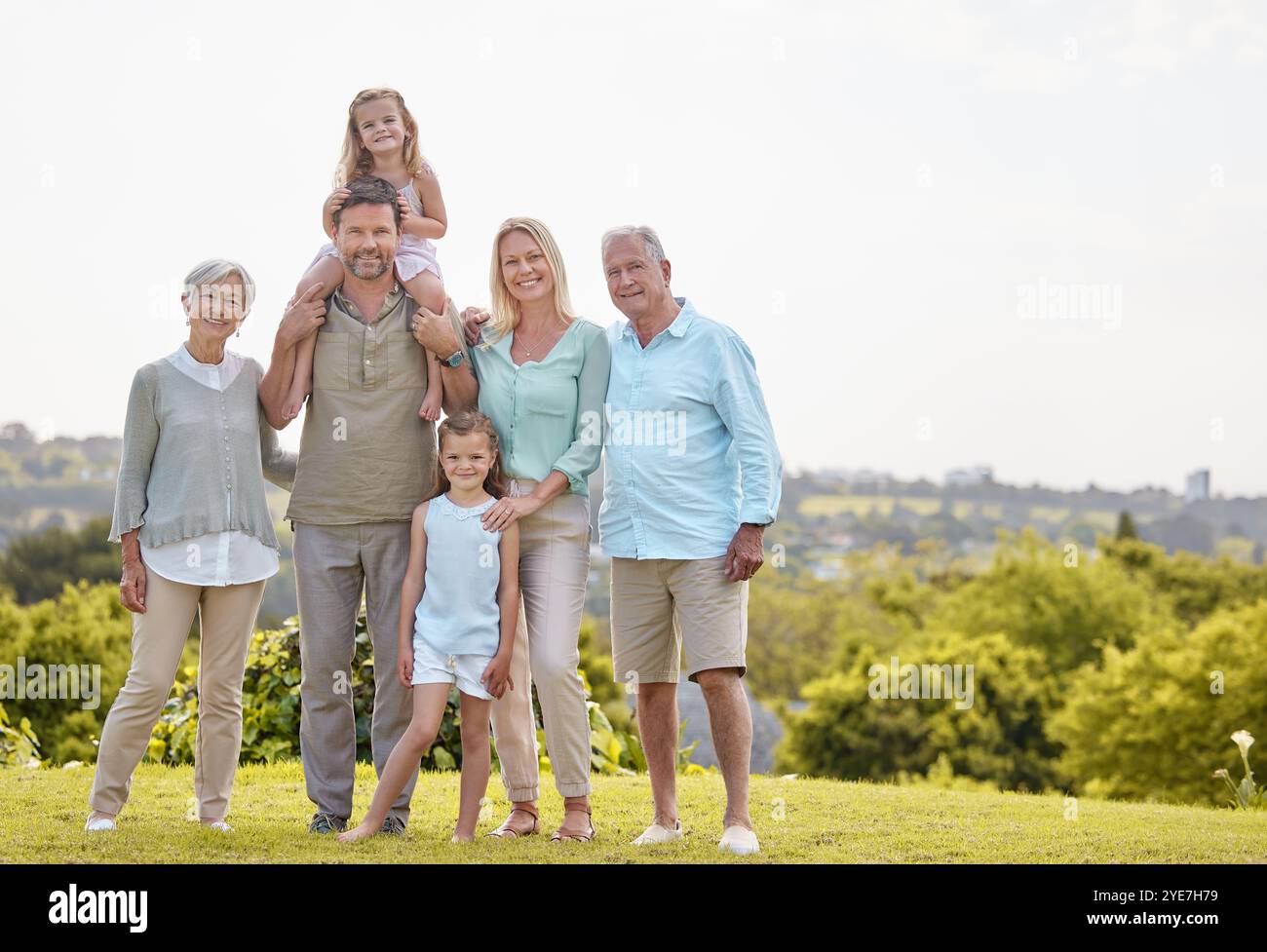 Portrait, generations and happy family in park with children, smile and ...