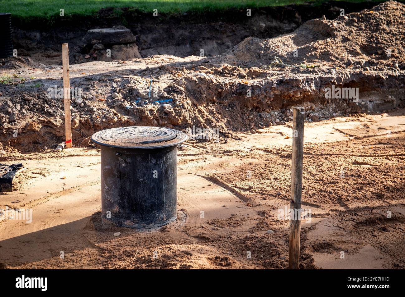 Sewer well and pipes, underground communications. Street repair Stock ...