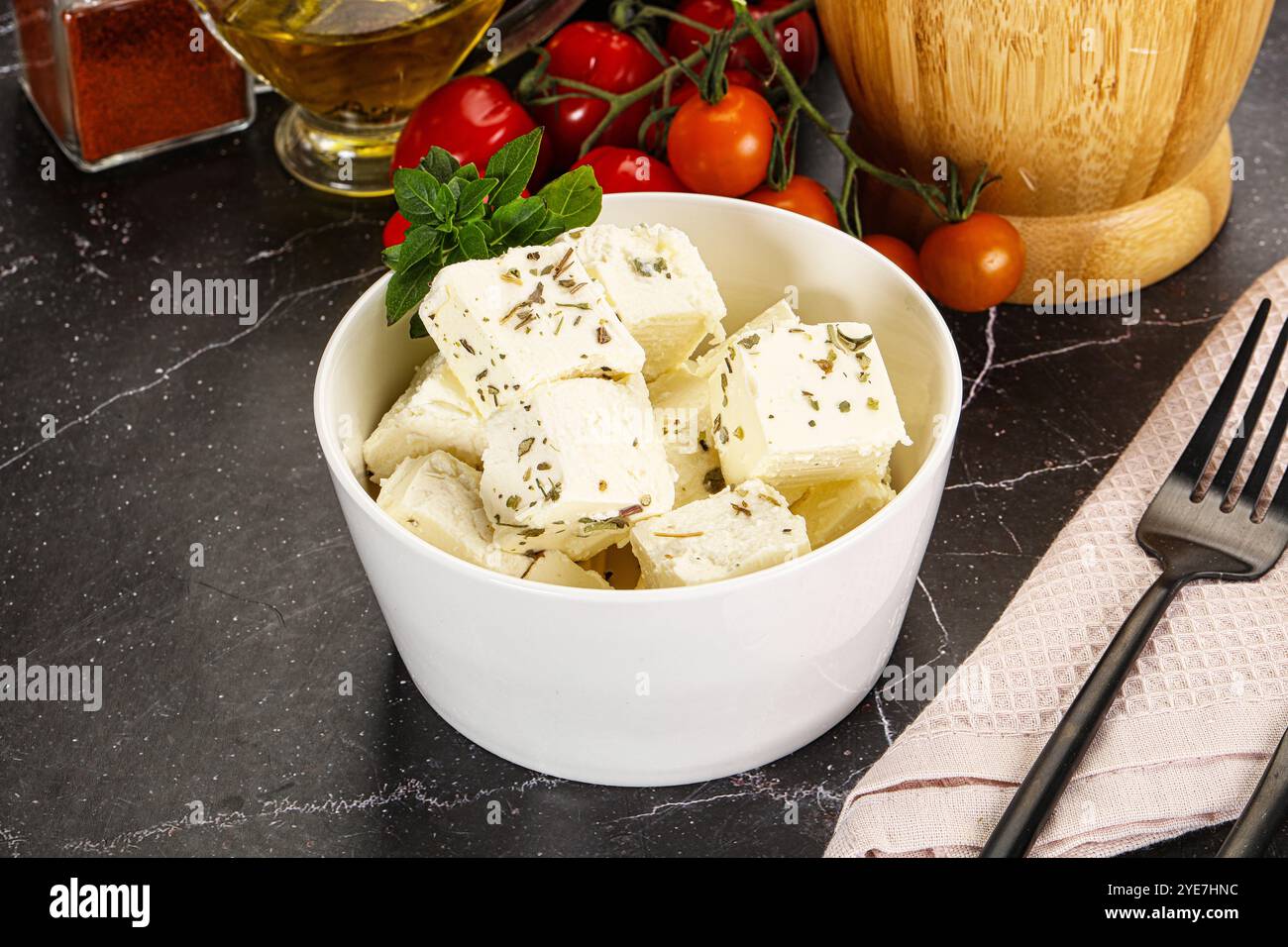 Greek traditional Feta cheese cubes with herbs and spices Stock Photo ...