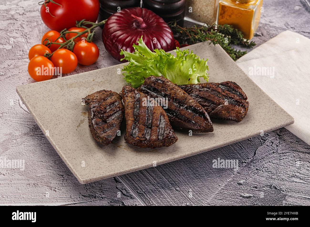 Grilled diet beef liver steak in the plate Stock Photo - Alamy