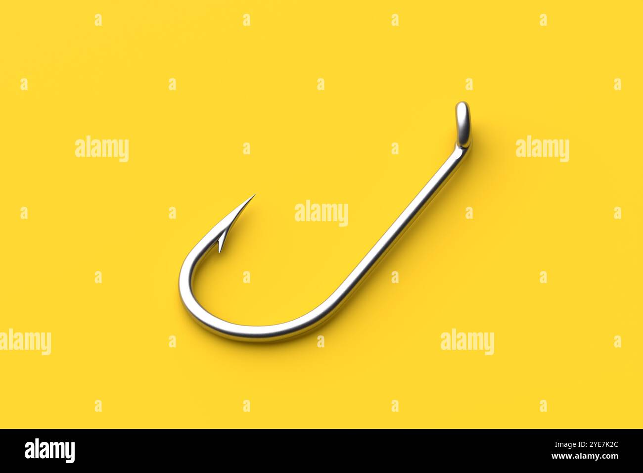 Fishing concept. Shiny metallic fish hook on yellow colored background ...