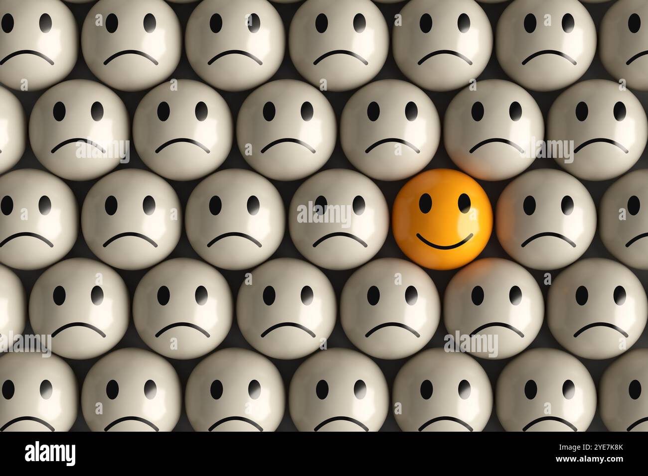 Yellow happy emoji face stands out in a sea of unhappy faces, conveying ...