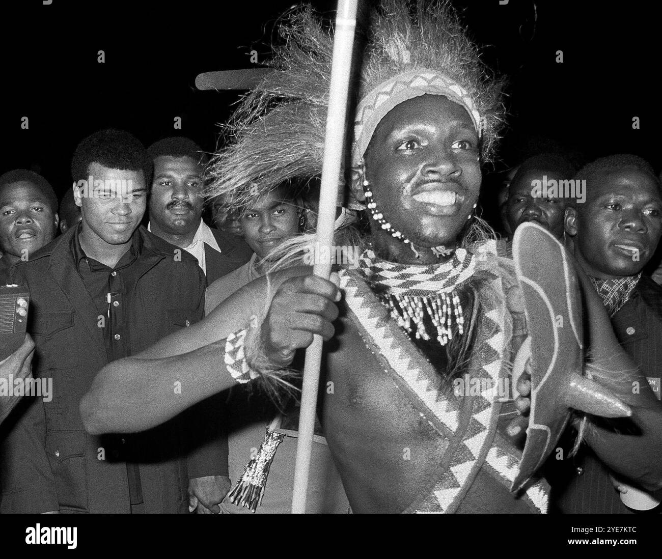 FILE - A Zairian man in traditional clothing carries a spear as he ...