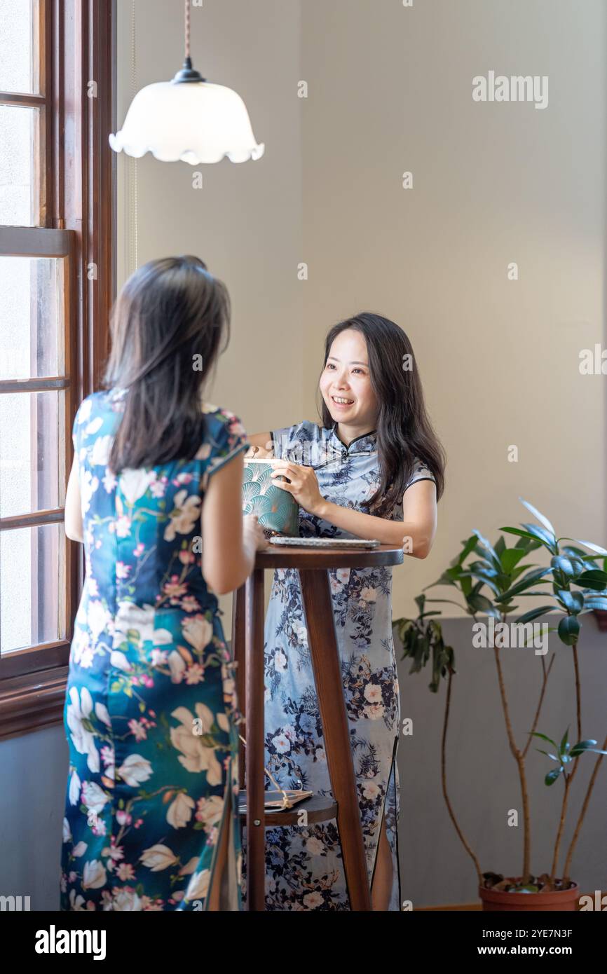 Two Taiwanese women in their 30s wearing traditional Chinese clothing ...