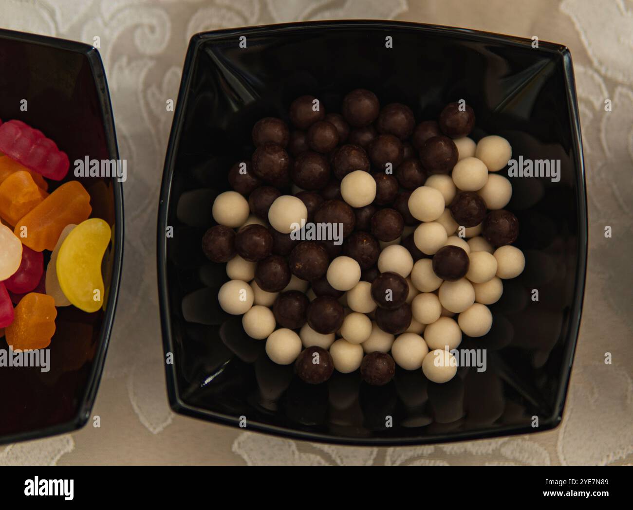 Detail of sweets formed into black and white balls Stock Photo - Alamy