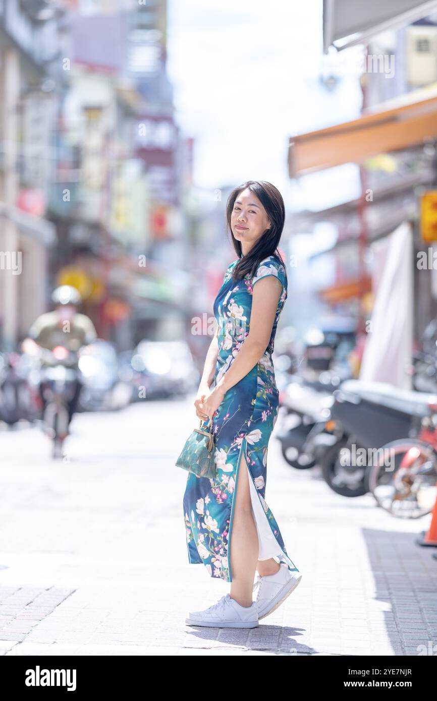 A Taiwanese woman in her 30s wearing traditional Chinese clothing is ...