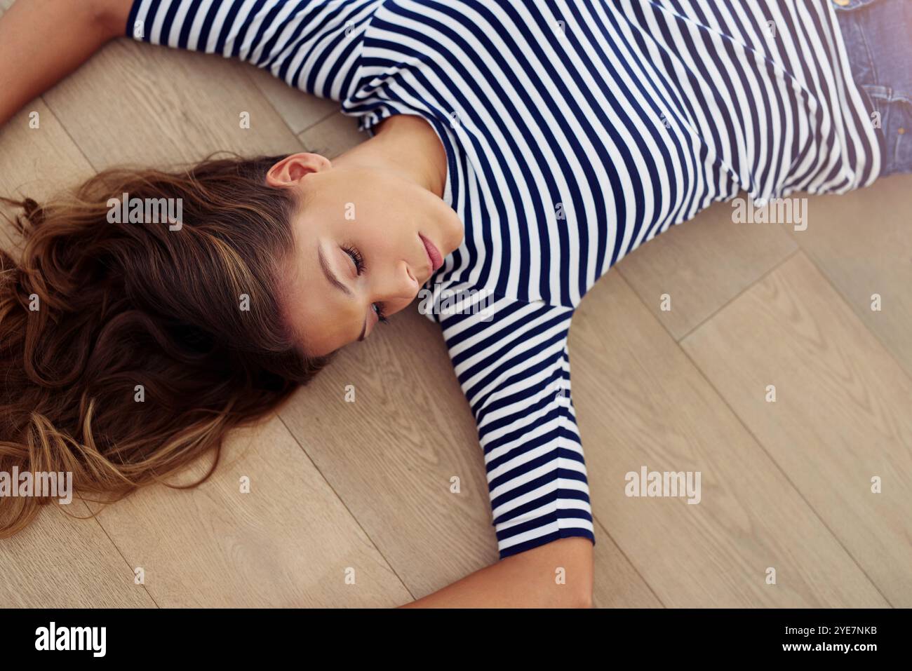 Above, woman and relax on home wooden floor with peace, calm and ...