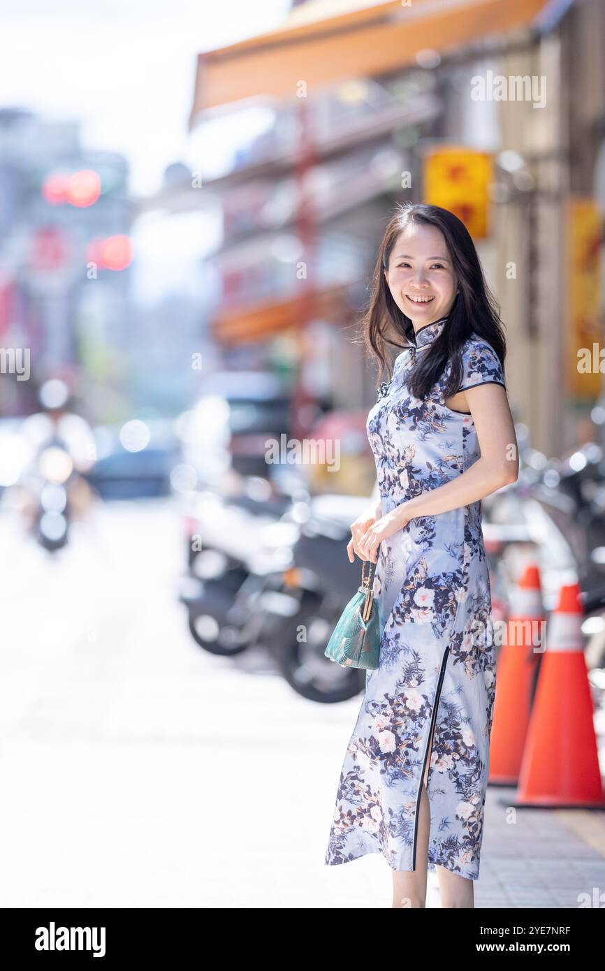 A Taiwanese woman in her 30s wearing traditional Chinese clothing is ...