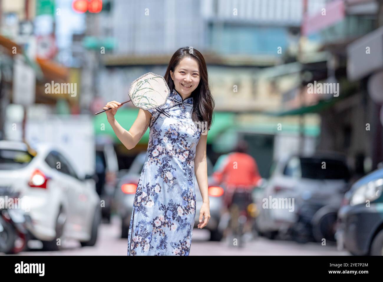A Taiwanese woman in her 30s wearing traditional Chinese clothing is ...