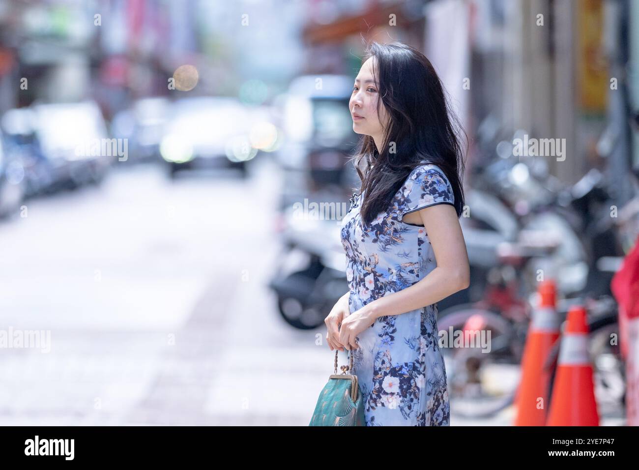 A Taiwanese woman in her 30s wearing traditional Chinese clothing is ...