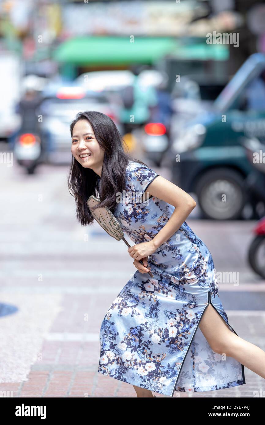 A Taiwanese woman in her 30s wearing traditional Chinese clothing is ...