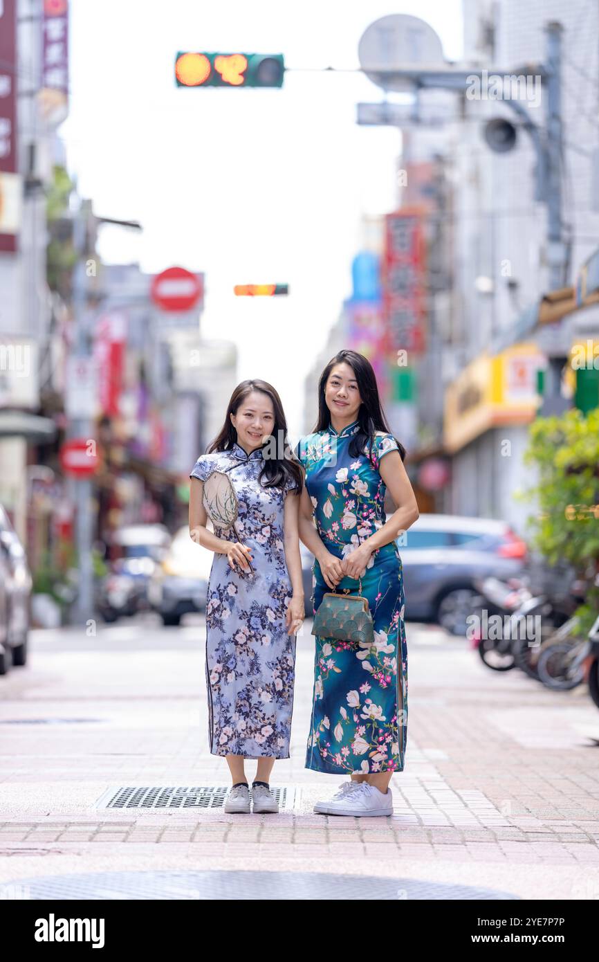 Two Taiwanese women in their 30s wearing traditional Chinese clothing ...