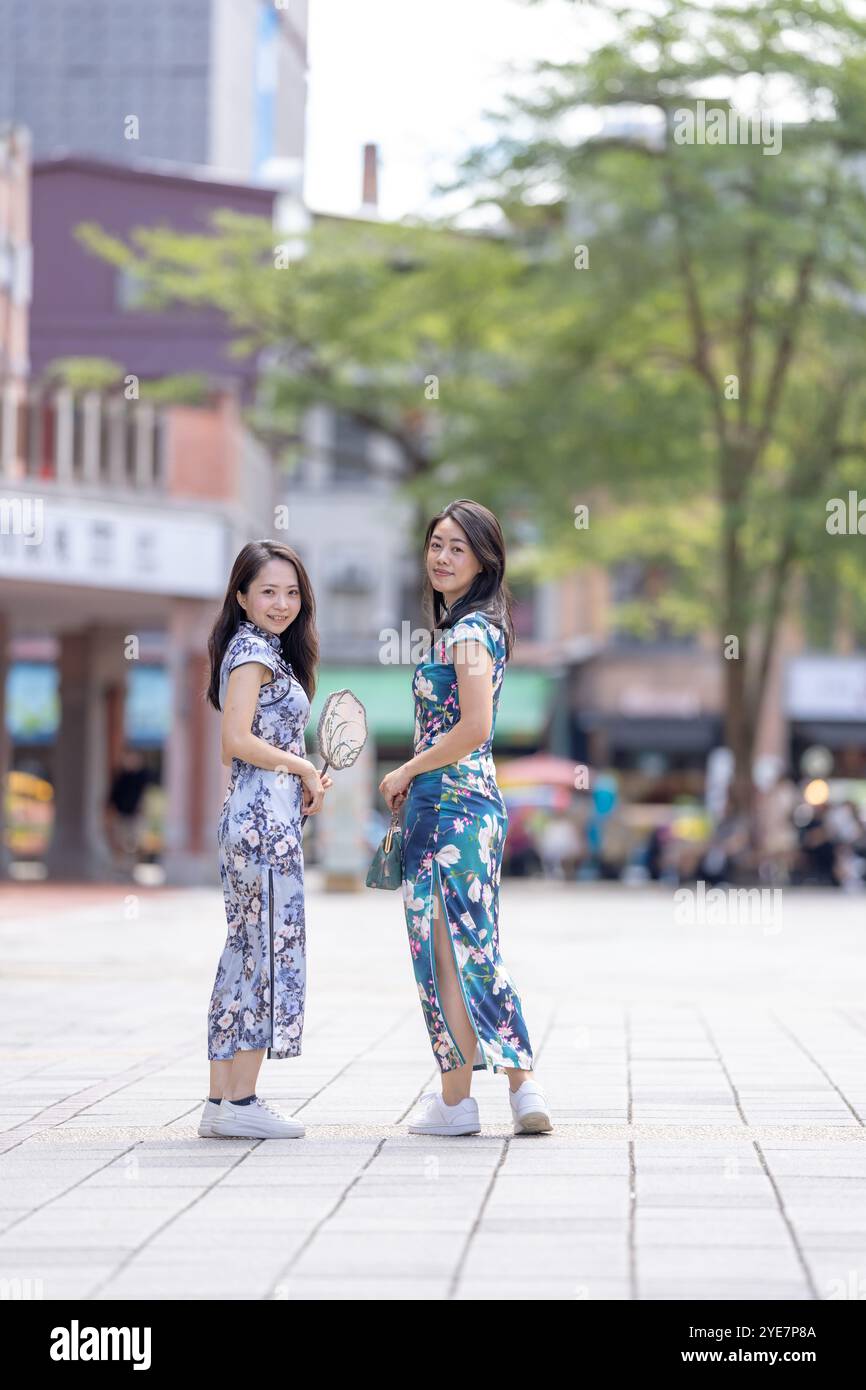 Two Taiwanese women in their 30s wearing traditional Chinese clothing ...