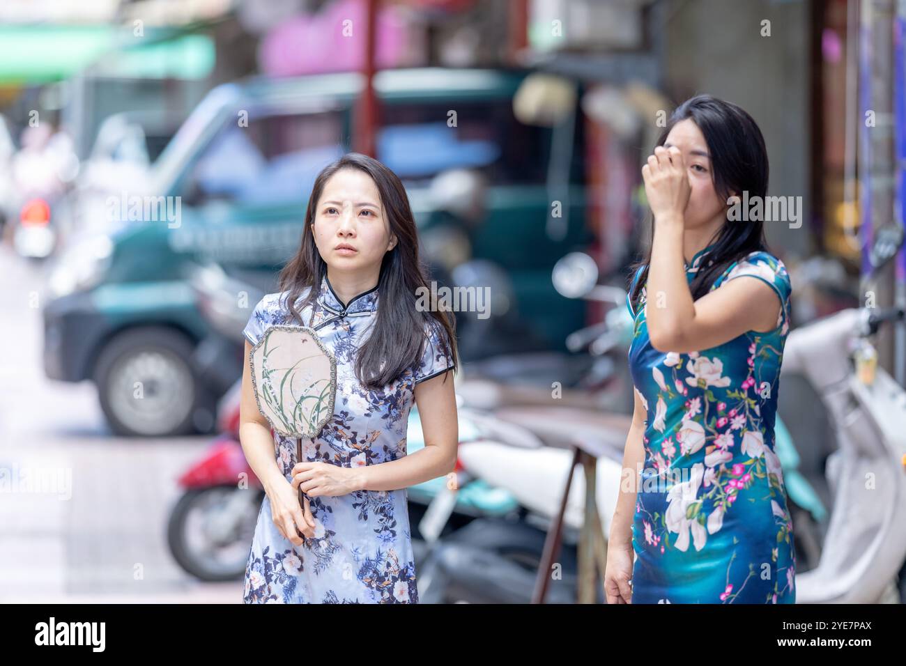 Two Taiwanese women in their 30s wearing traditional Chinese clothing ...