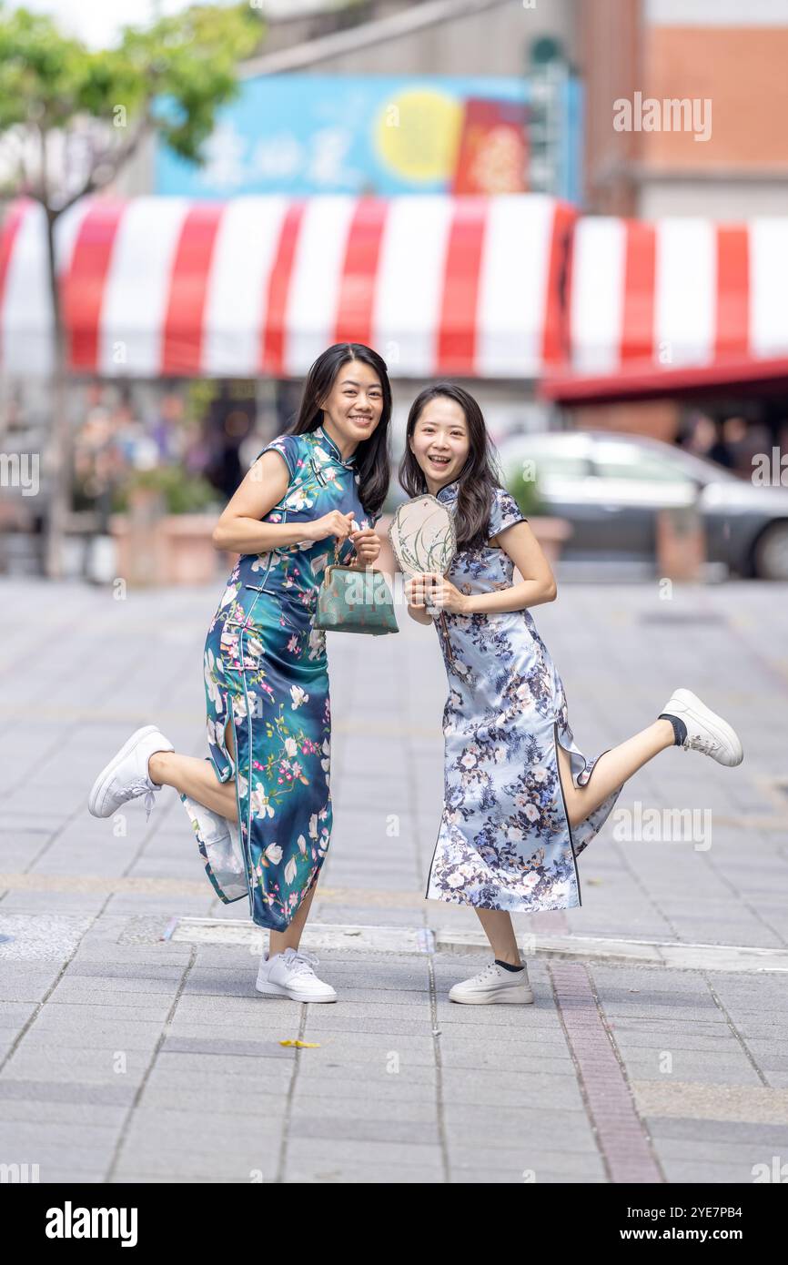 Two Taiwanese women in their 30s wearing traditional Chinese clothing ...